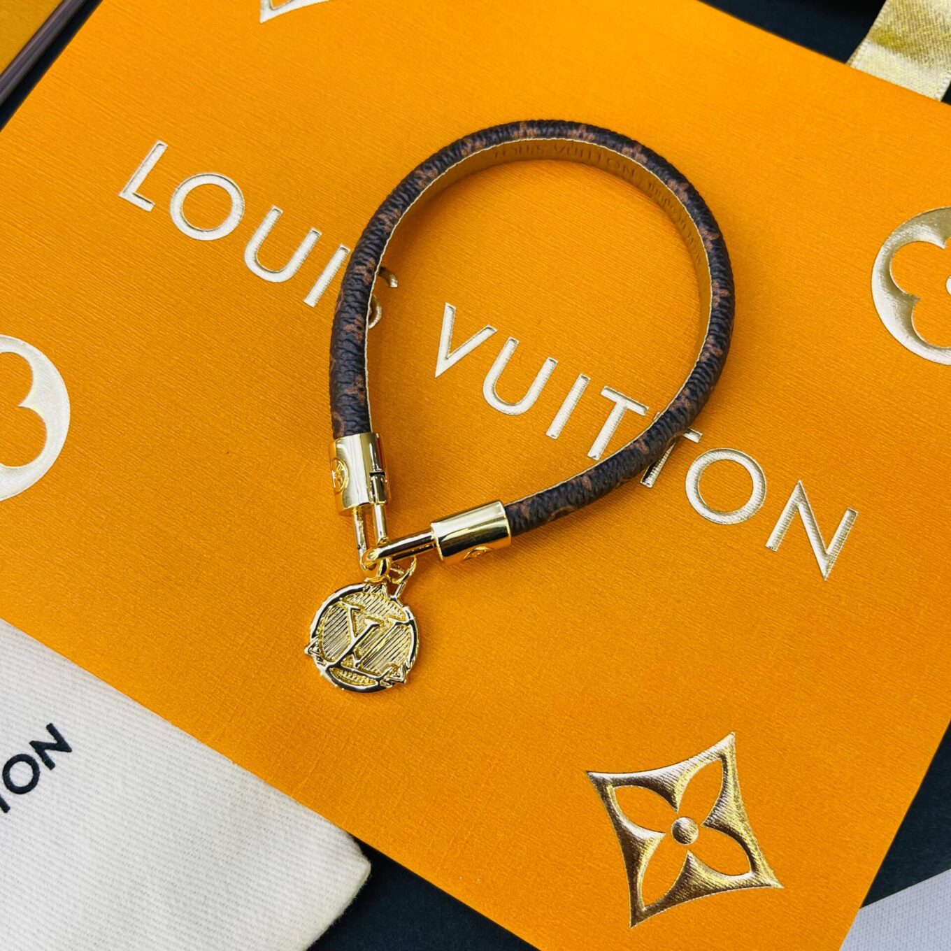 Louis Vuitton Monogram Charm Wrist Band - TheLuxuryTag