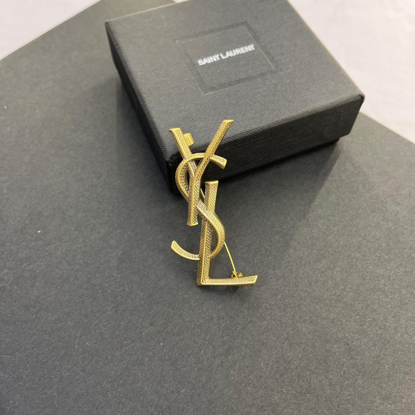 YSL Golden Monogram Brooch - TheLuxuryTag