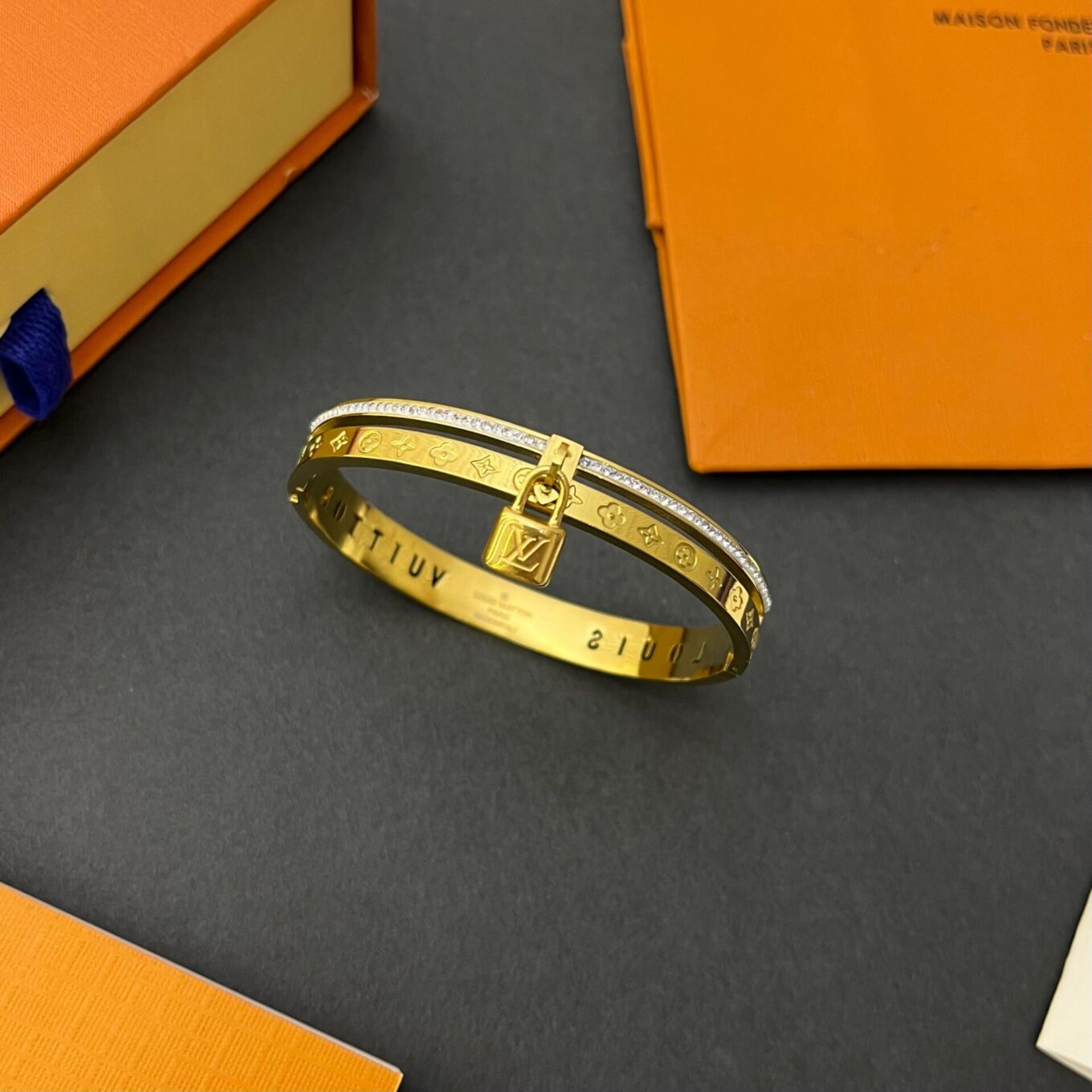 Louis Vuitton Lock Me Monogram Bracelet - TheLuxuryTag